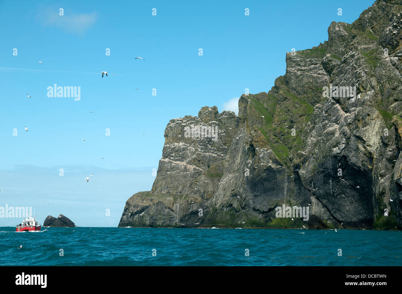 Tourist boat approaching the island of Boreray, St Kilda archipelago ...