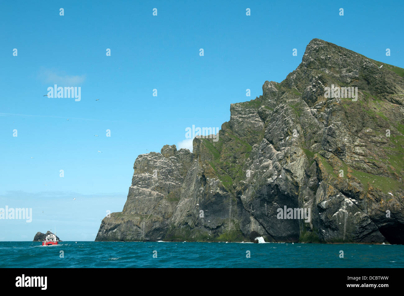 Tourist boat approaching the island of Boreray, St Kilda archipelago ...