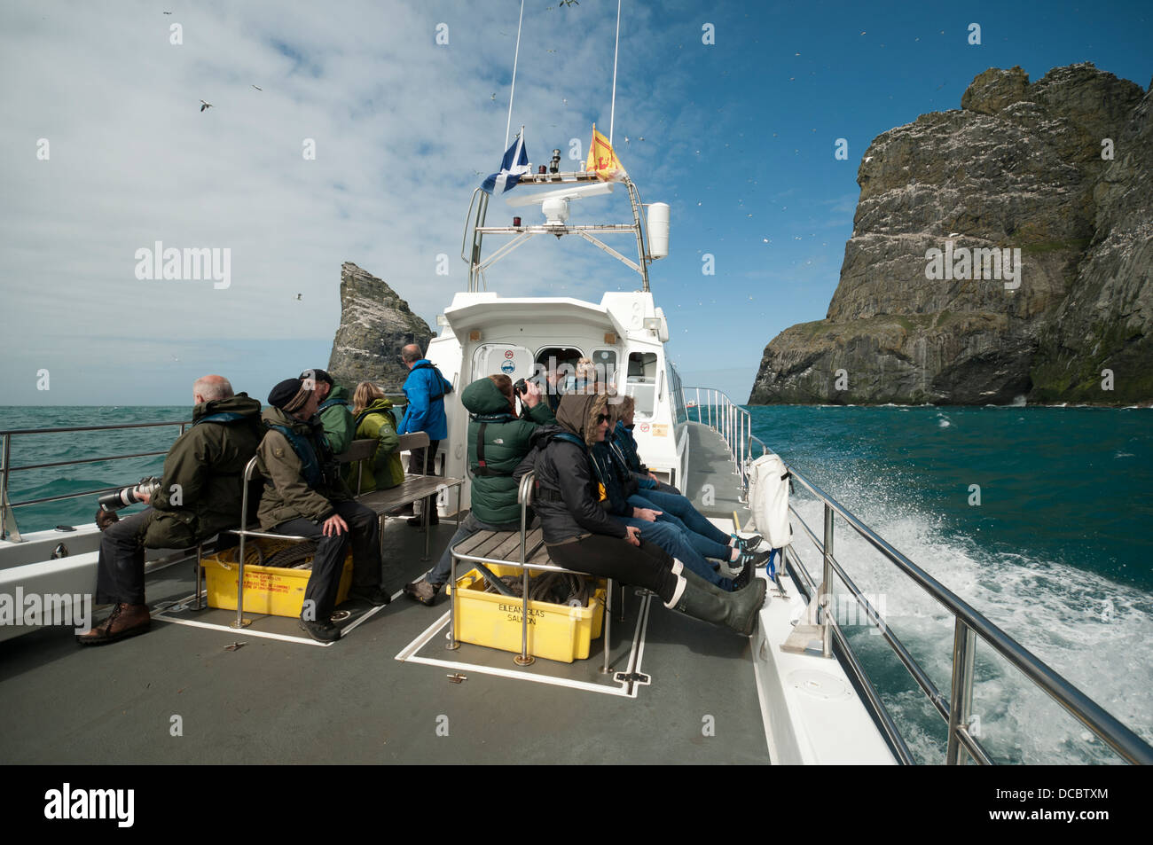 Tourist boat approaching the island of Boreray, St Kilda archipelago ...