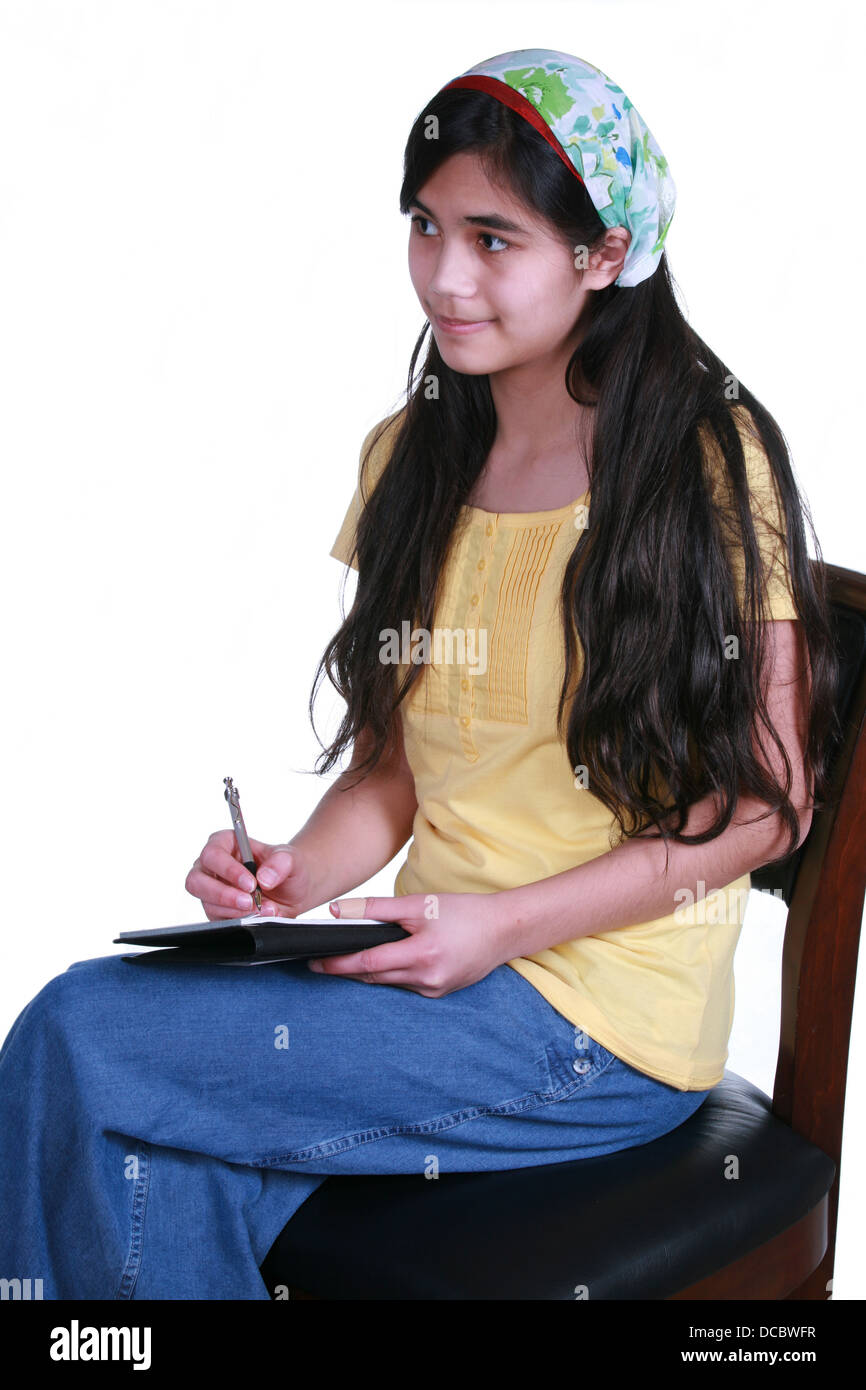 Teenage girl taking notes Stock Photo - Alamy