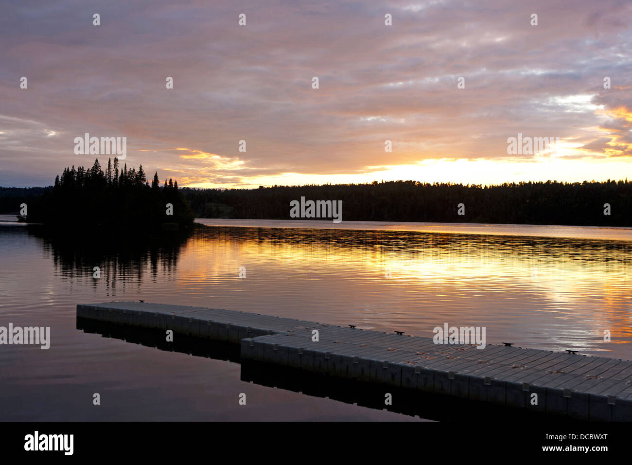 Dock and island at sunset, Tobin Harbor, Isle Royale National Park ...
