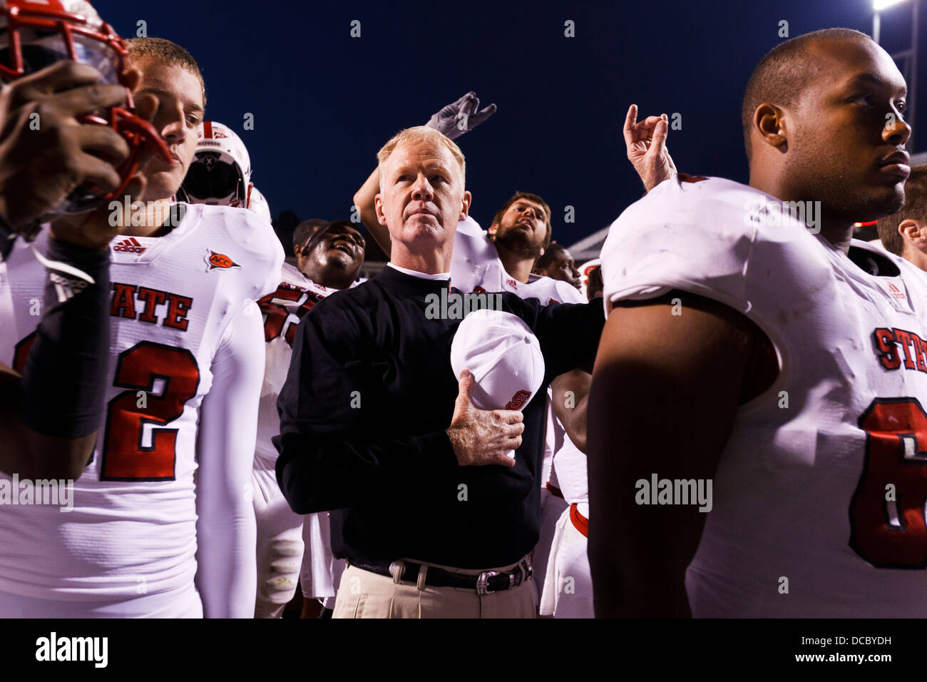 North Carolina State Wolfpack head coach Tom O'Brien (center ...