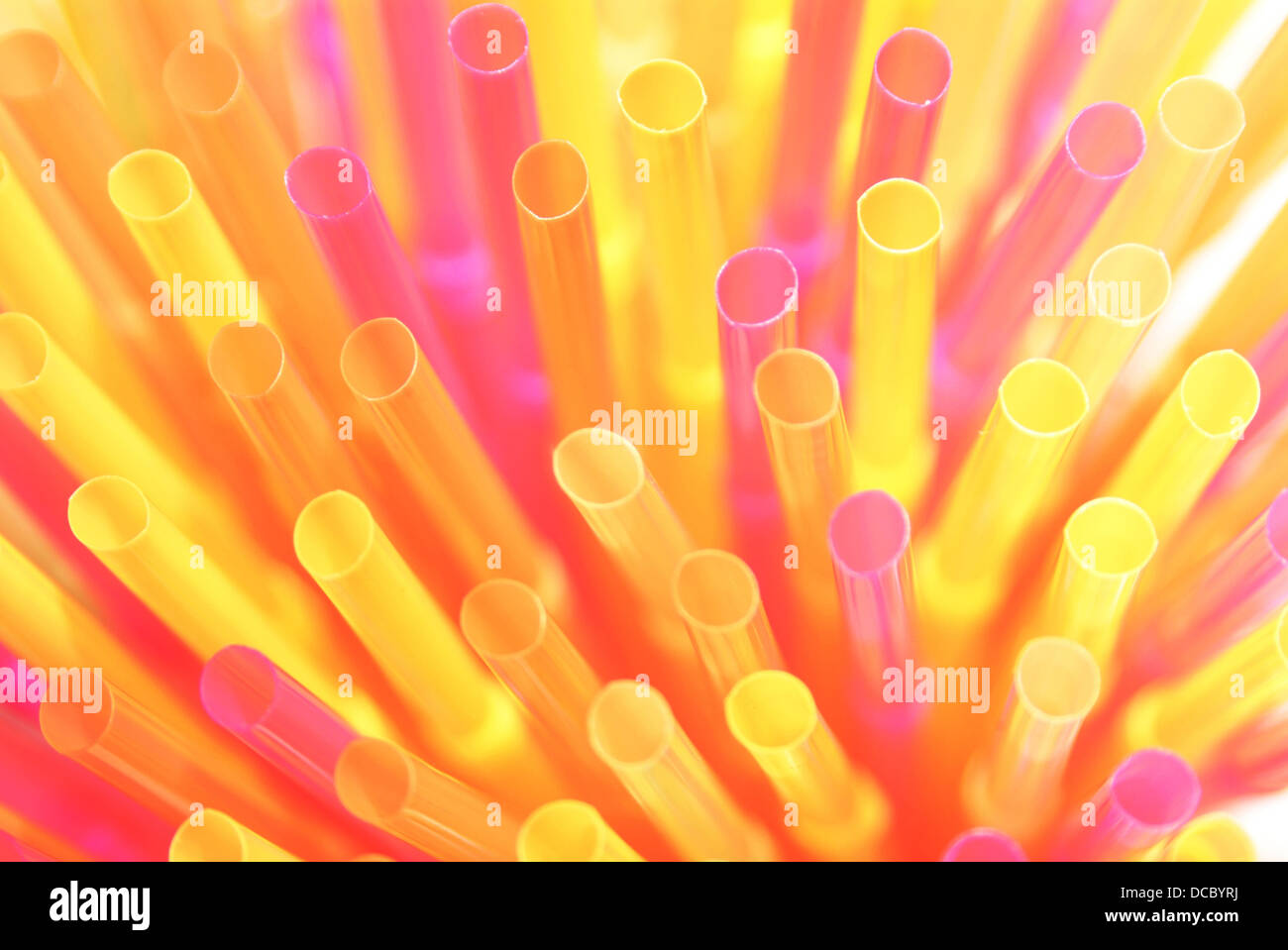 some plastic straws in different colours colors Stock Photo - Alamy