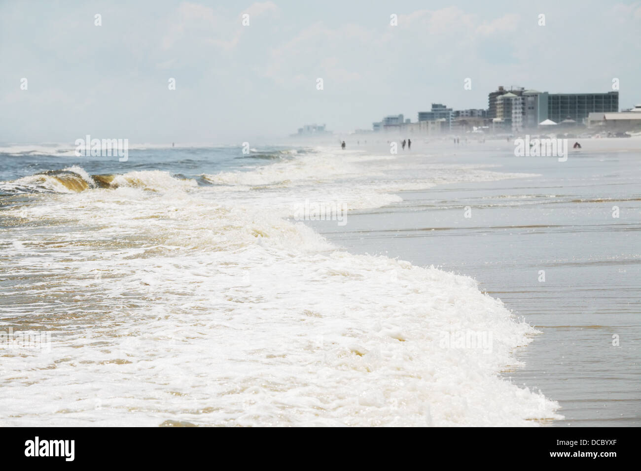 Waves coming in at beach Stock Photo - Alamy