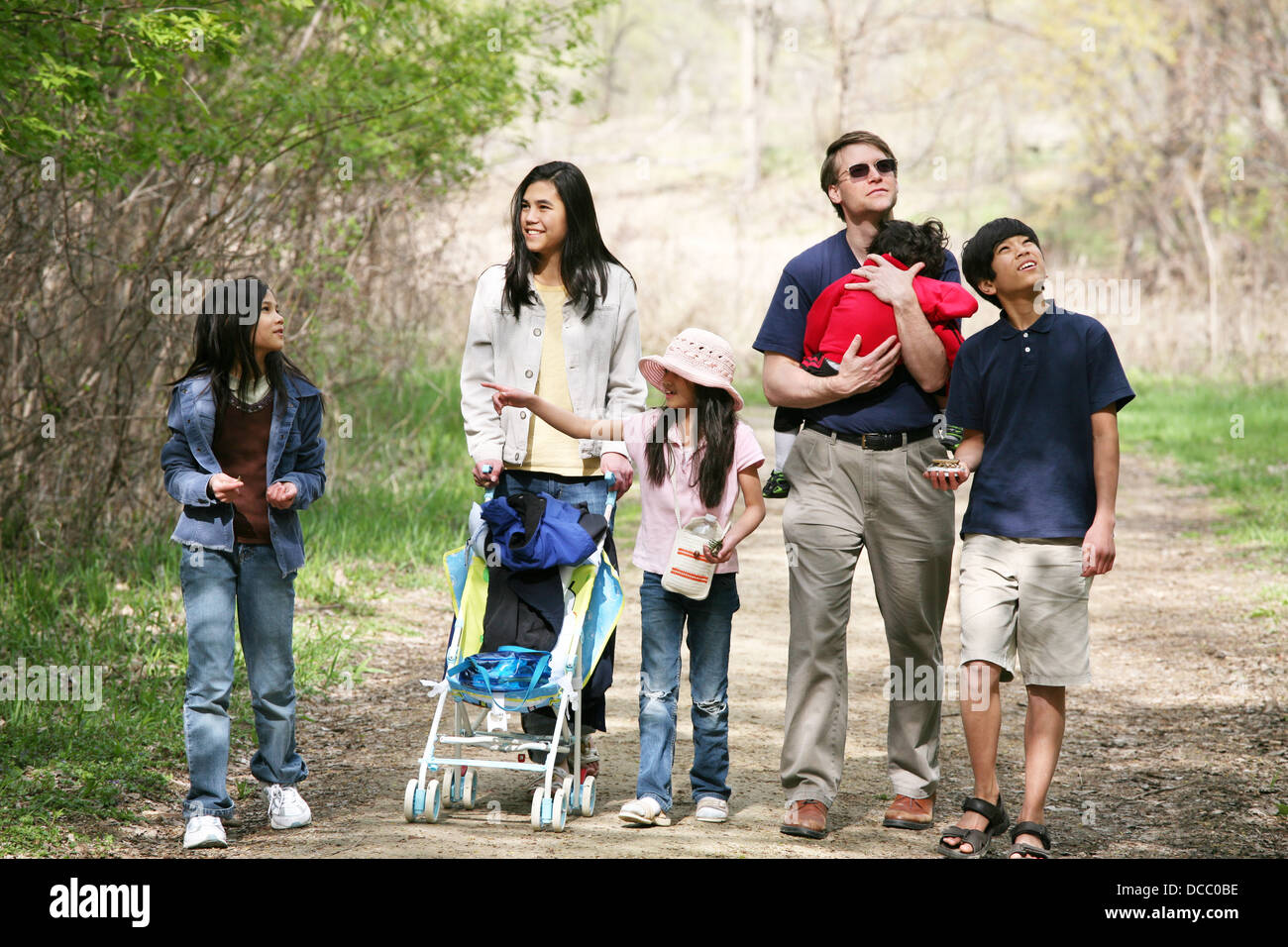 Family walking along country path Stock Photo - Alamy