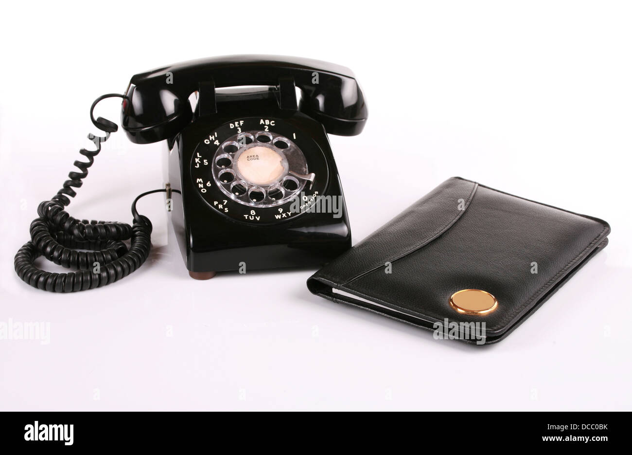 Old fashioned phone and notepad Stock Photo - Alamy