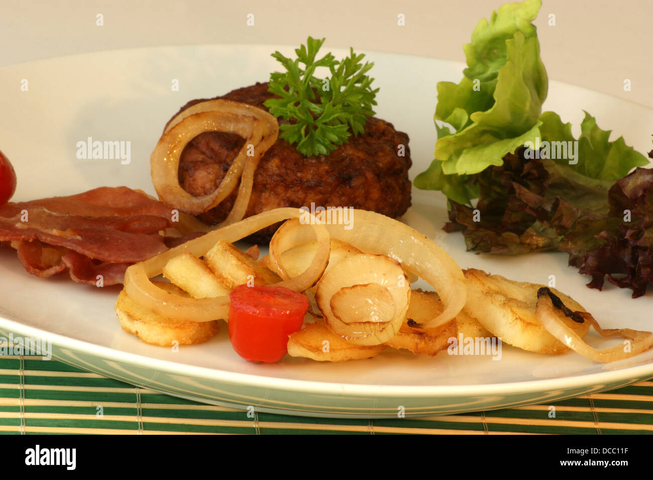 rissole with grilled bacon and onion on a plate Stock Photo - Alamy