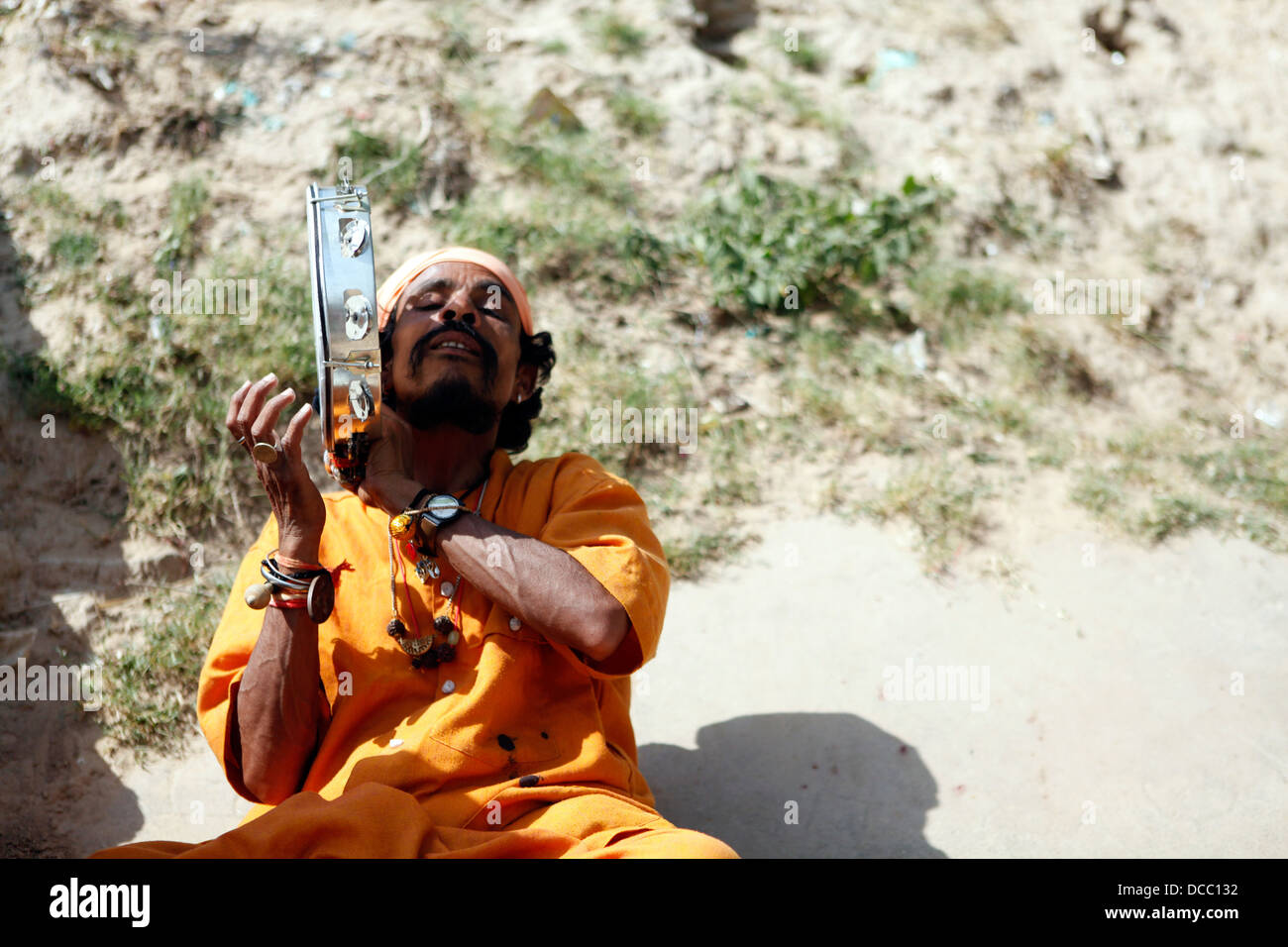 A blind singer sings outside a temple in Varanasi, India Stock Photo ...