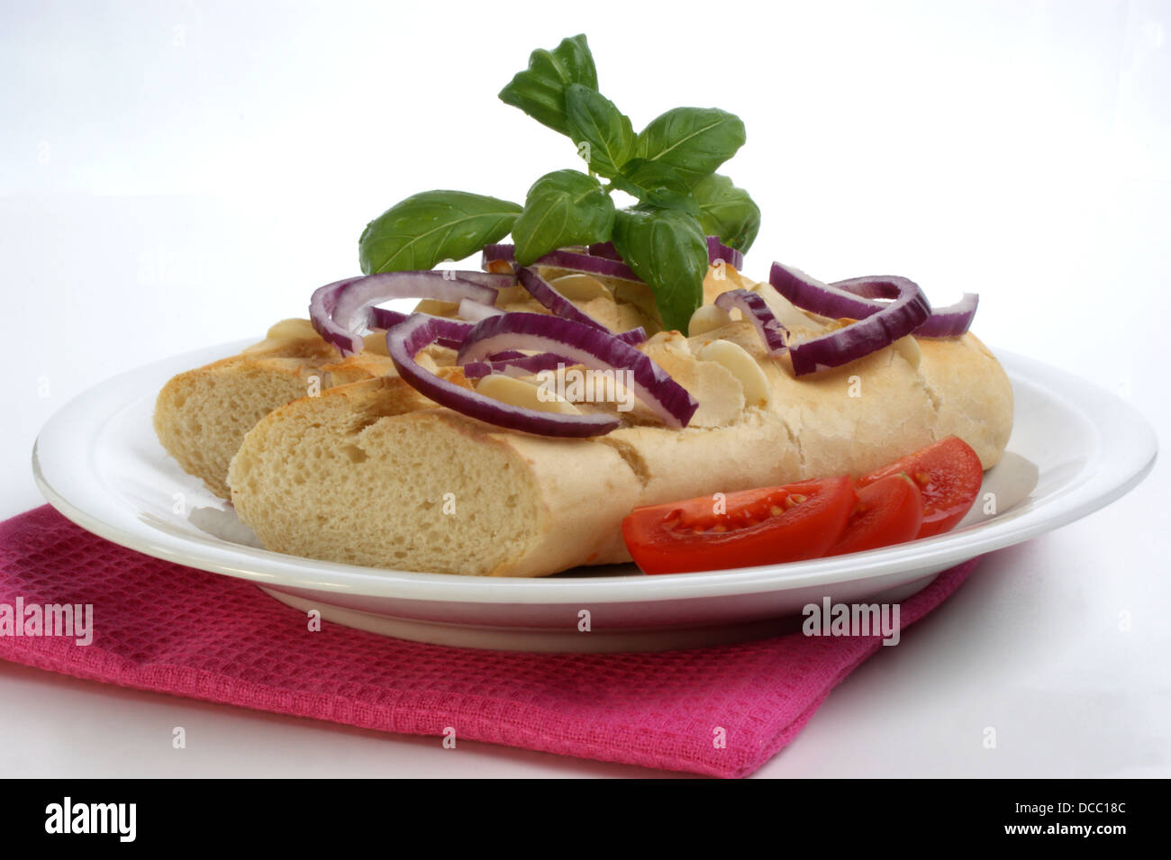 baguette as a snack with onion and tomato Stock Photo - Alamy