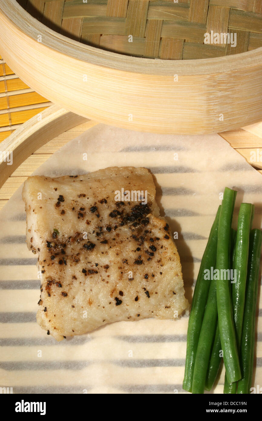 vietnamese river cobbler fillet in a bamboo steamer Stock Photo - Alamy