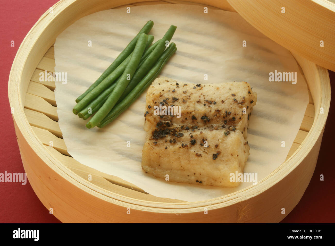 vietnamese river cobbler fillet in a bamboo steamer Stock Photo - Alamy
