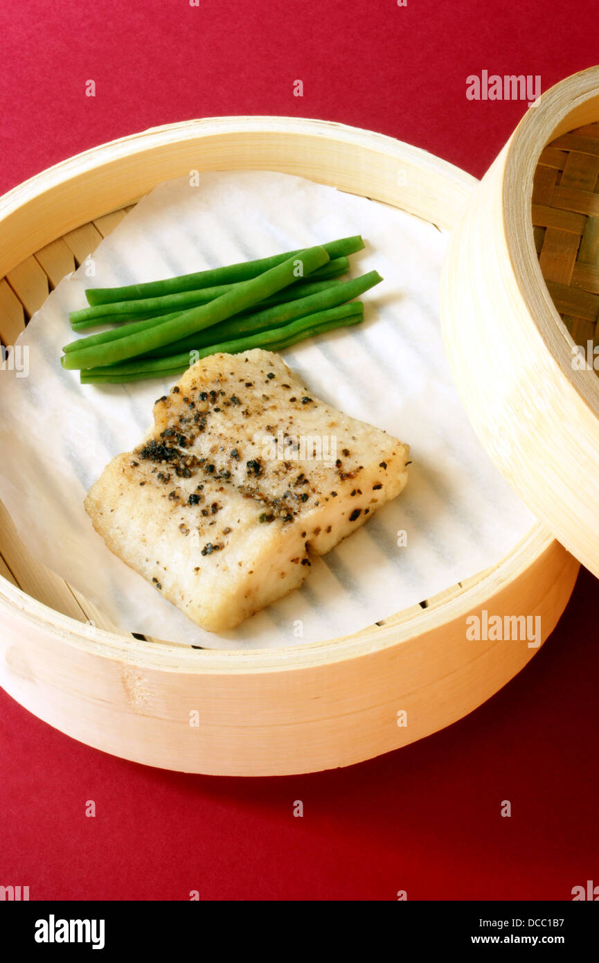 vietnamese river cobbler fillet in a bamboo steamer Stock Photo - Alamy