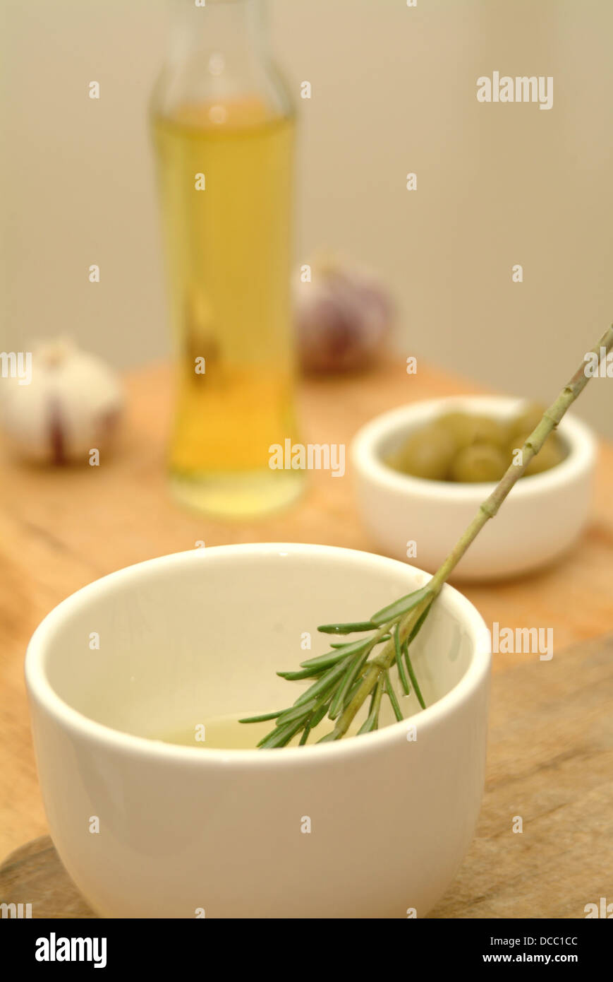 Rosmary with some oil in a white bowl Stock Photo - Alamy