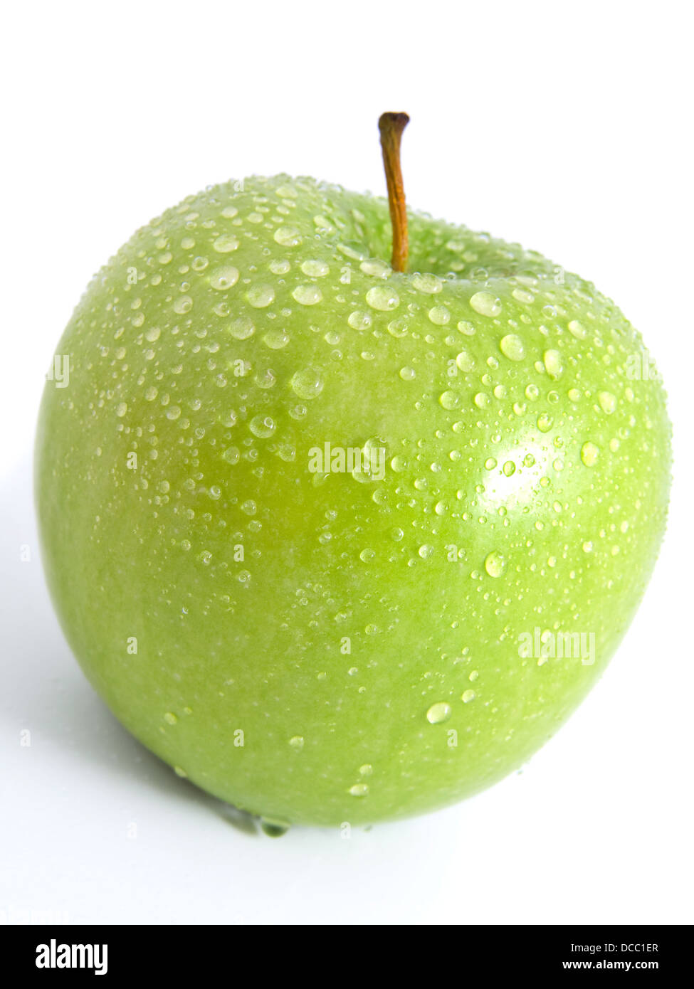 Juicy ripe green apple on a white background Stock Photo - Alamy