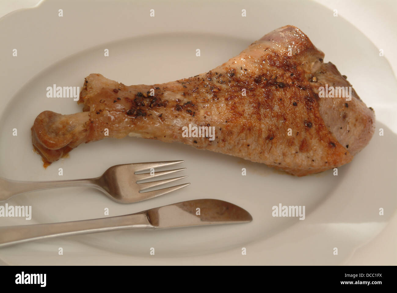 roasted turkey leg on a white plate Stock Photo - Alamy
