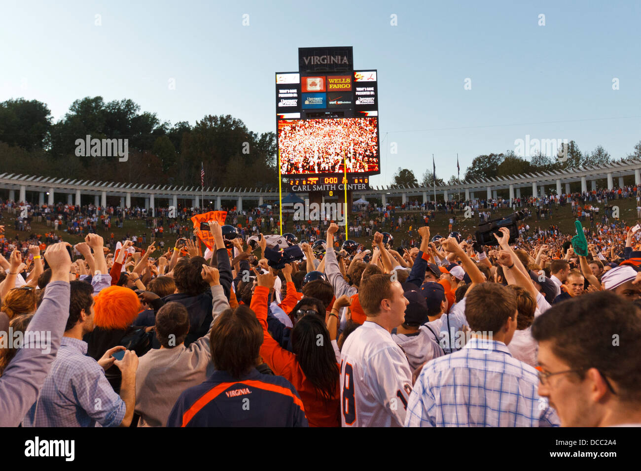 Virginia Cavaliers fans celebrate on the field after the game against ...