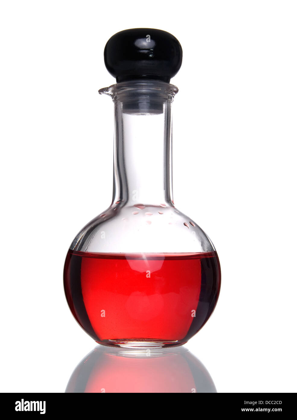 Flask with a red liquid on a white background Stock Photo - Alamy
