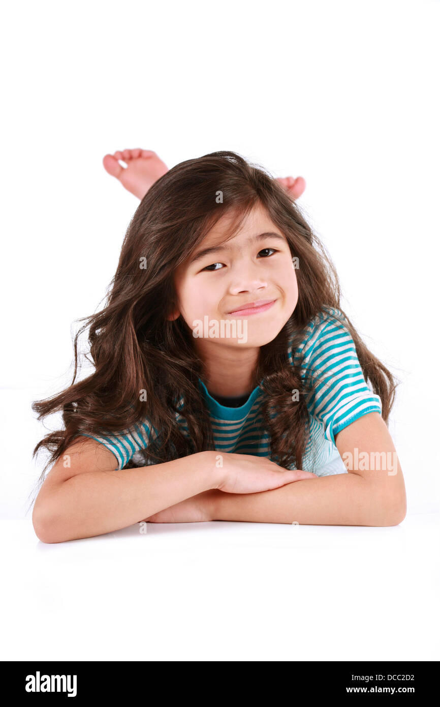 Beautiful little girl lying on floor Stock Photo - Alamy
