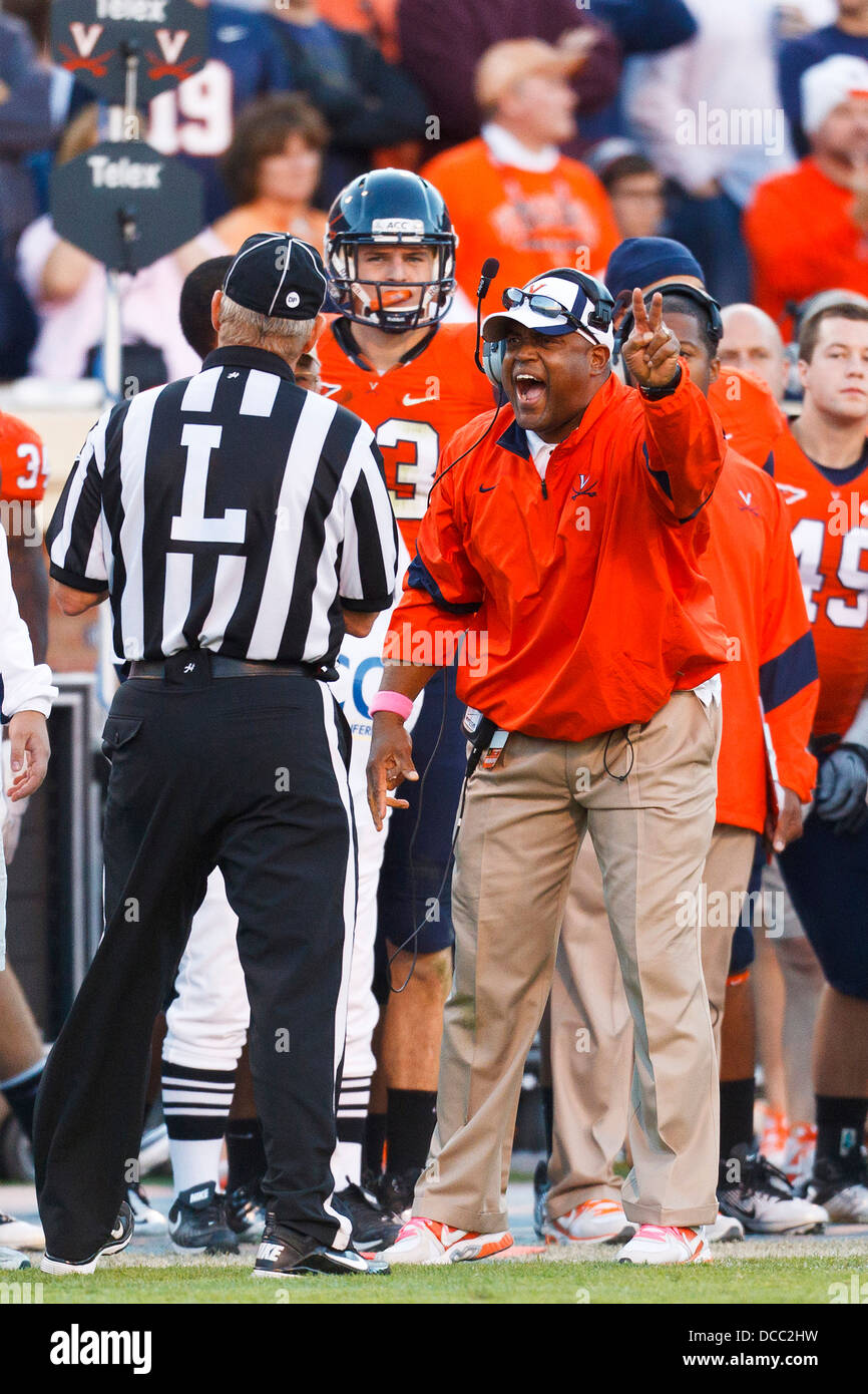 Virginia Cavaliers head coach Mike London argues a call on the ...