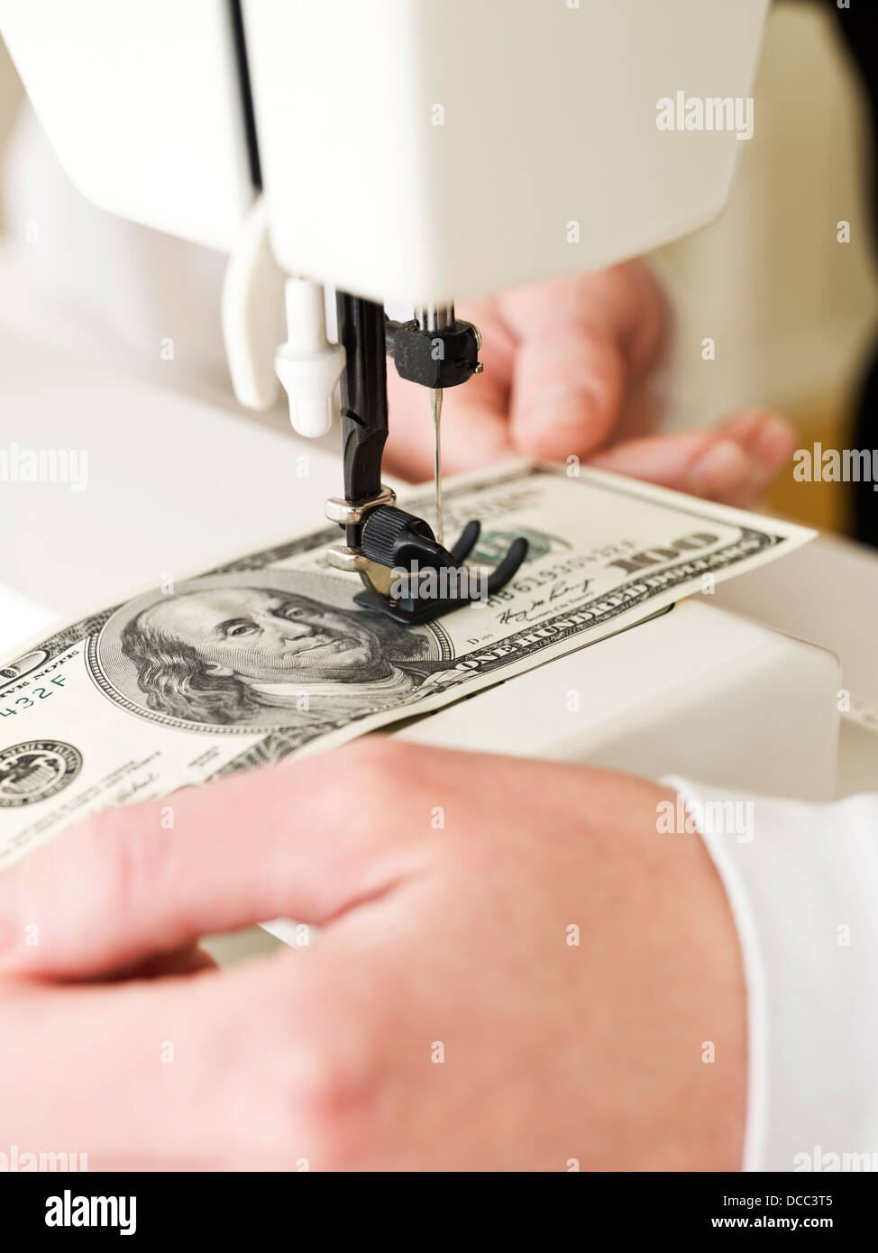 Sewing a dollar bank note Stock Photo - Alamy