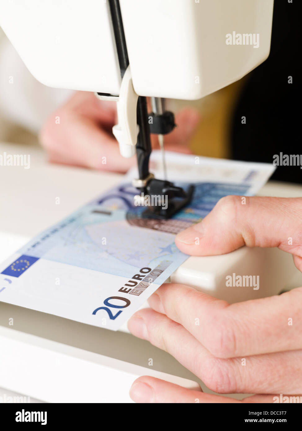Sewing a Euro bank note Stock Photo - Alamy