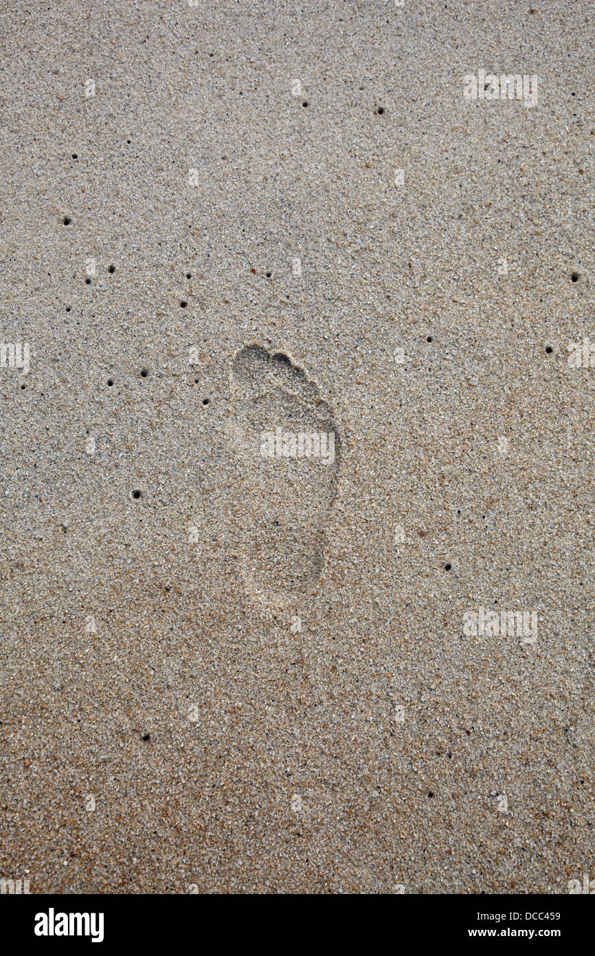 It's a photo of a footstep or footsteps on the sand on the beach near ...