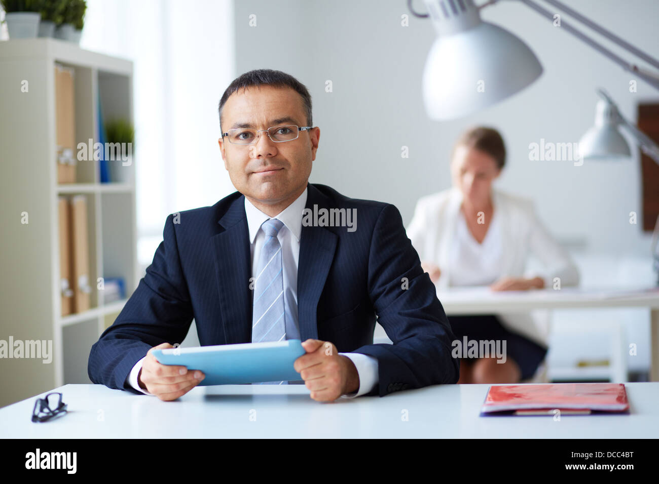 Formally dressed businesspeople planning work in office Stock Photo - Alamy