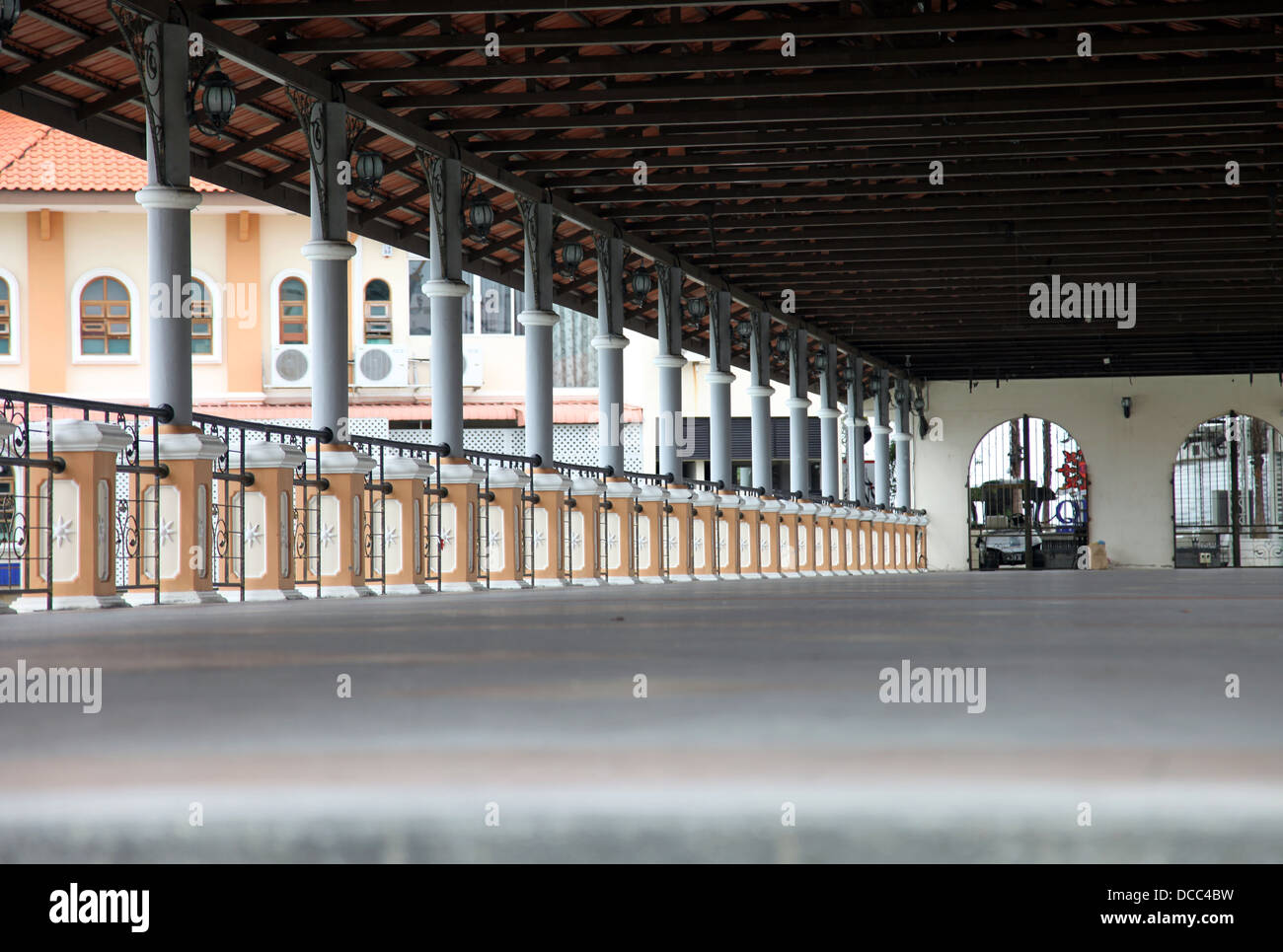 It's a photo of a covered platform or covered bridge near the sea or a ...