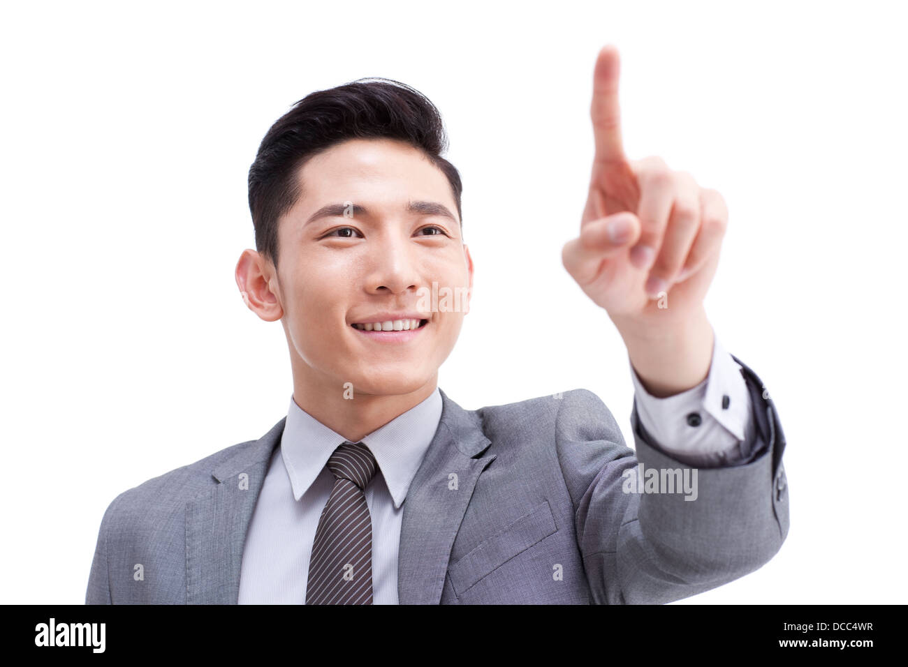 Cheerful young businessman pointing forward Stock Photo - Alamy
