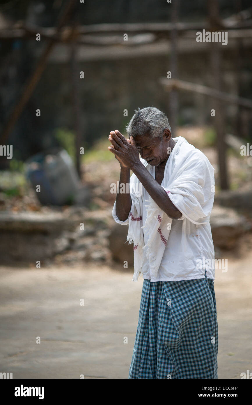Hindu prayer in the ancient temple Stock Photo - Alamy