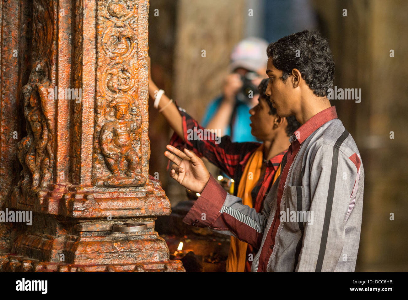 Hindu prayer in the ancient temple Stock Photo - Alamy