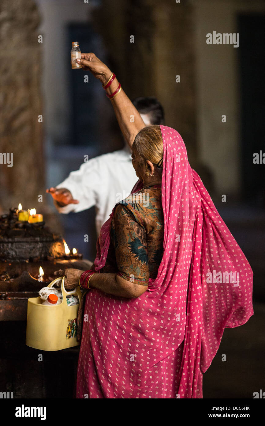 Hindu prayer in the ancient temple Stock Photo - Alamy