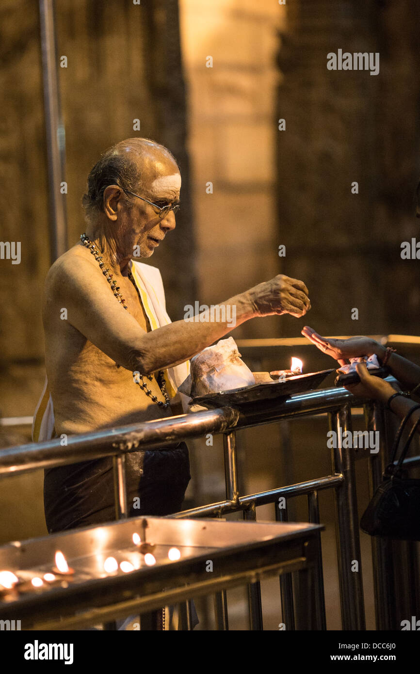 Hindu prayer in the ancient temple Stock Photo - Alamy