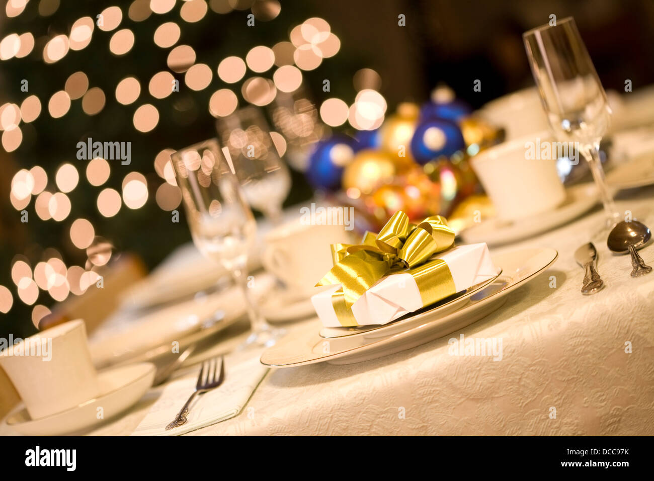 Gold present on dining table Stock Photo - Alamy