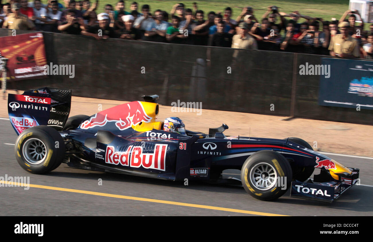 Formula One racer Daniel Ricciardo of Australia drives on Delhi's ...