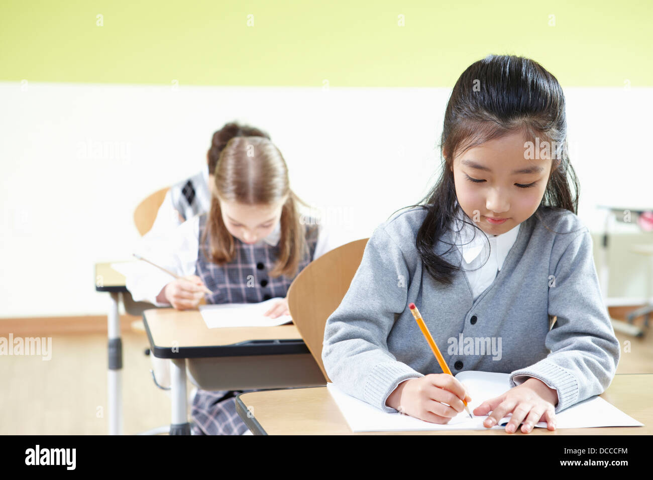 students studying hard in a classroom Stock Photo - Alamy