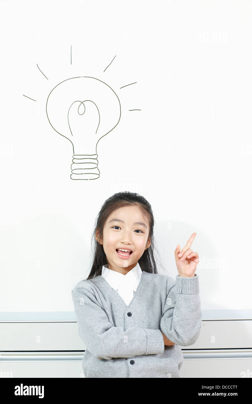 a student with a light bulb Stock Photo - Alamy