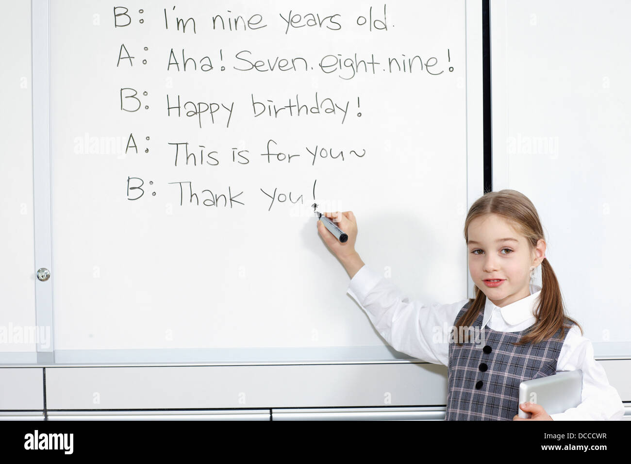a student explaining using a whiteboard Stock Photo - Alamy