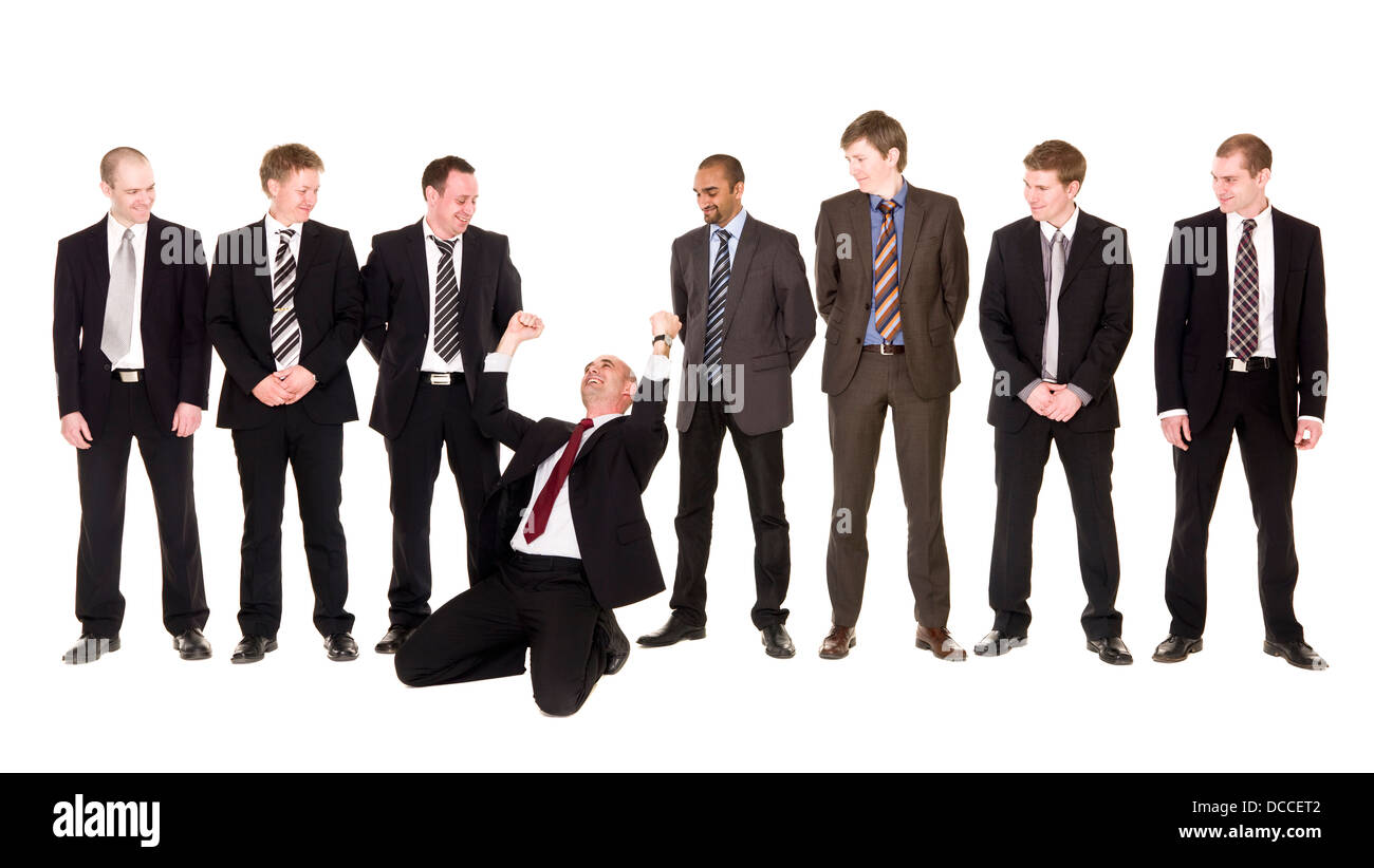 Happy man in front of his team Stock Photo - Alamy