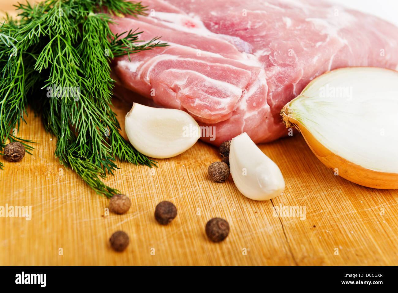 Raw fresh meat on board with condiments on white background Stock Photo ...