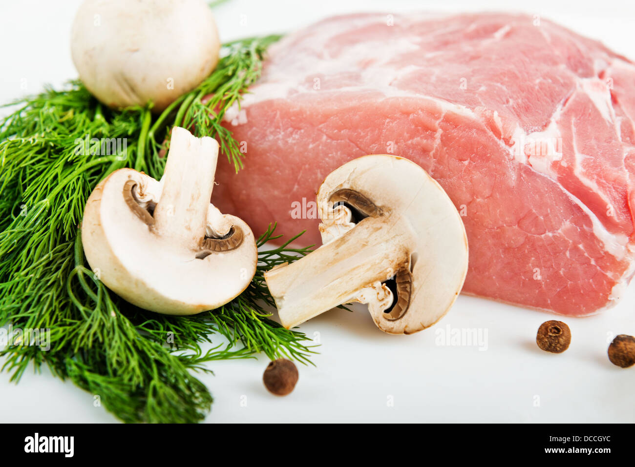 Raw fresh meat on board with condiments on white background Stock Photo ...