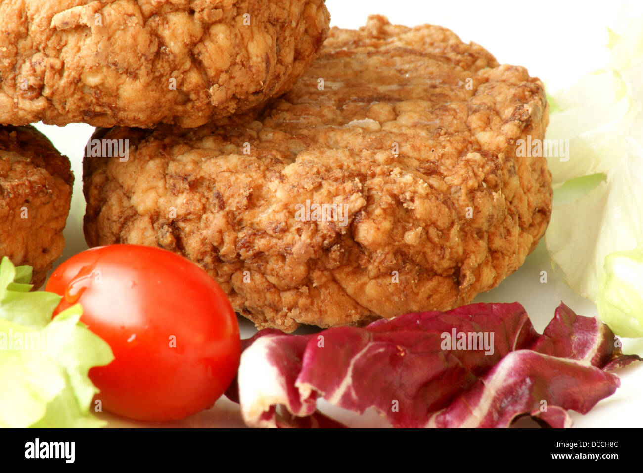 rissole with organic tomato on a plate Stock Photo - Alamy
