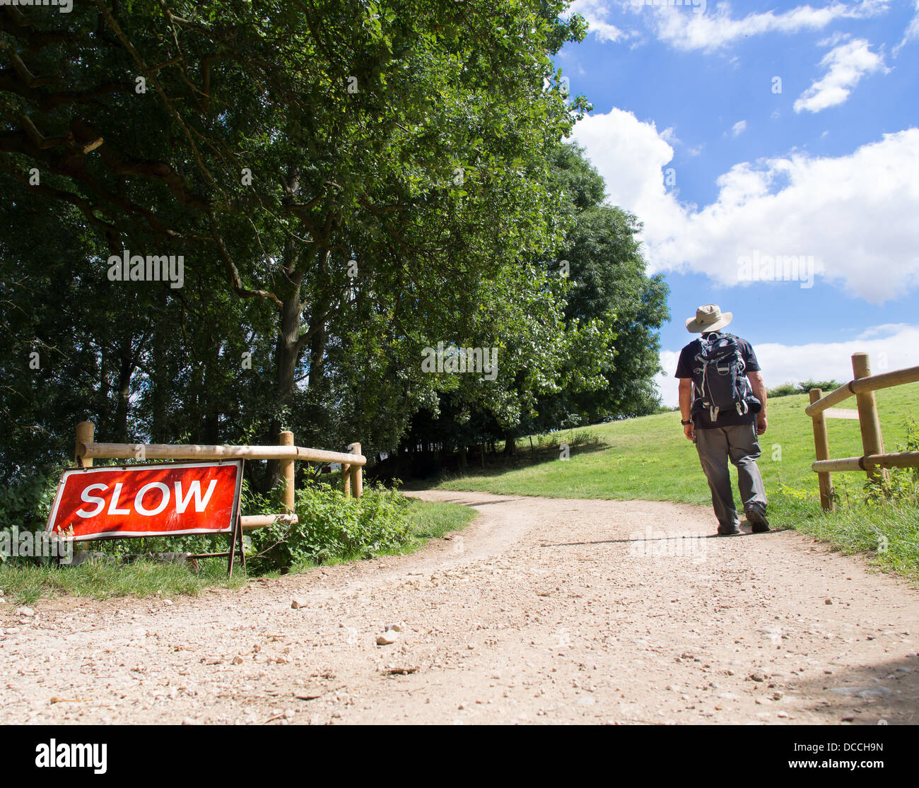 A rambler walks slowly along a path on a summer day Stock Photo - Alamy