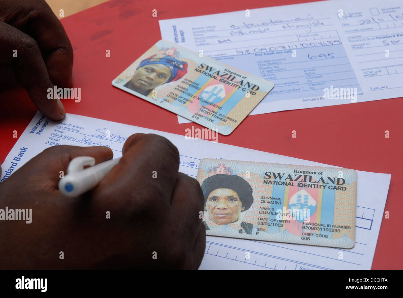 Cash transfer beneficiaries receiving cash at the Siphofaneni Post ...