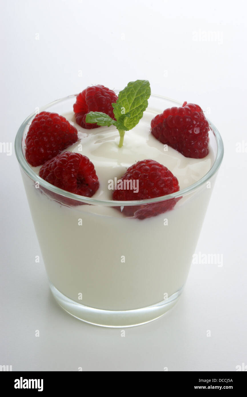 some organic raspberries in natural yogurt and mint Stock Photo - Alamy