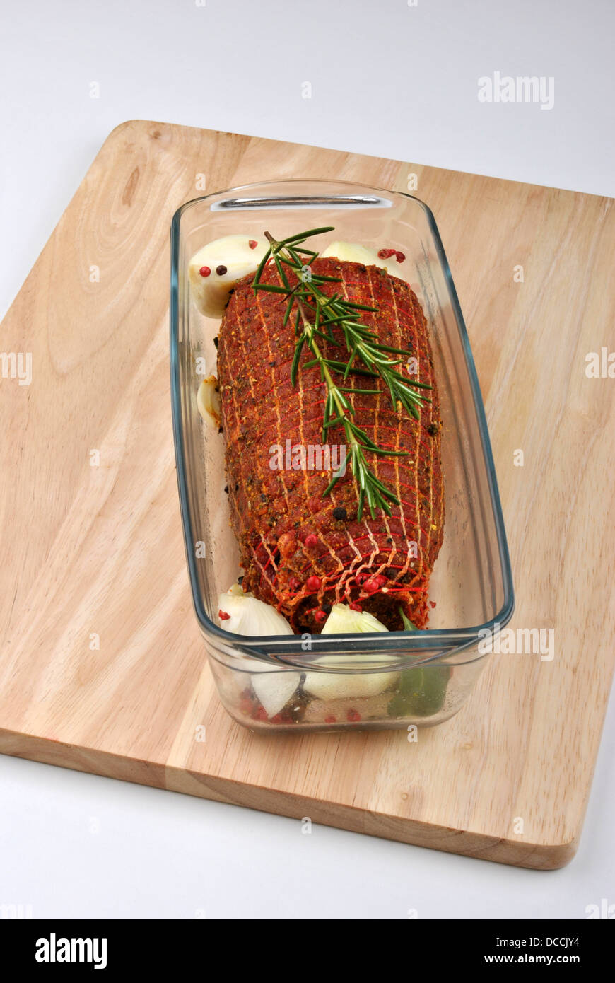 raw beef roll with organic rosemary and onion Stock Photo - Alamy