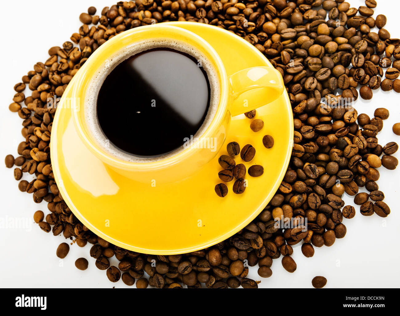 Coffee in an yellow cup Stock Photo - Alamy