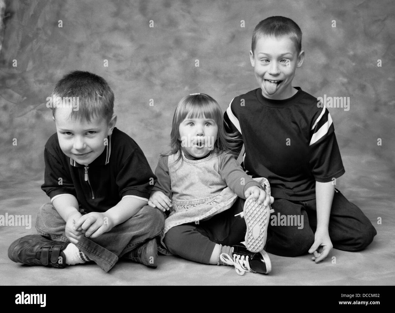 Girl making funny faces at boy hi-res stock photography and images - Alamy