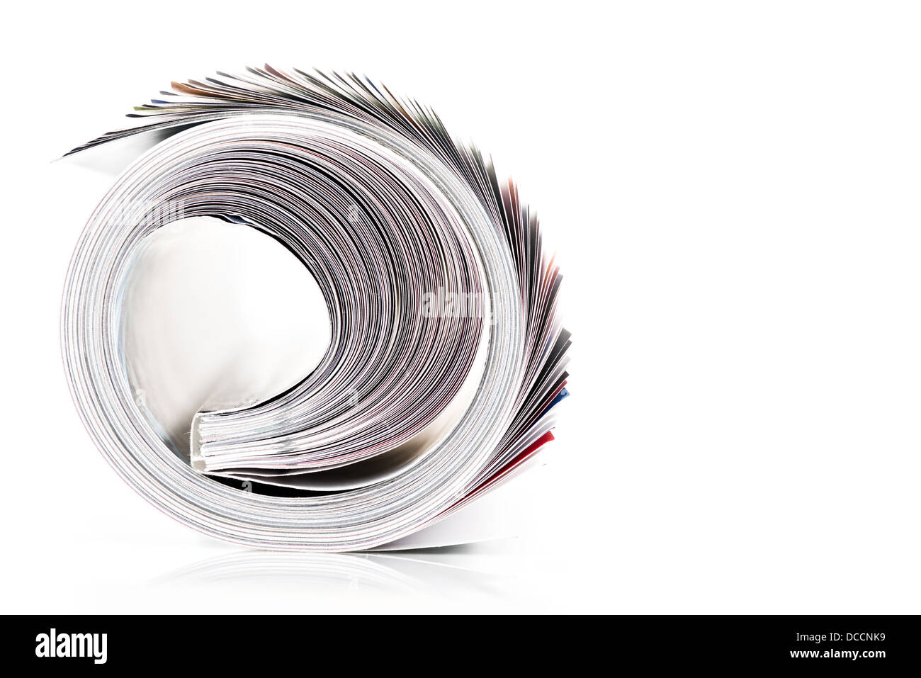 magazine roll on white background Stock Photo - Alamy