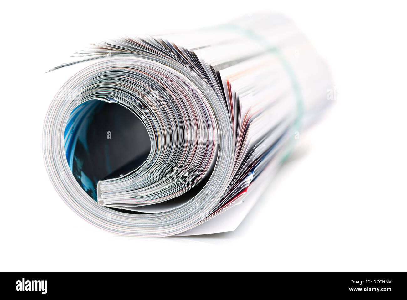magazine roll on white background Stock Photo - Alamy